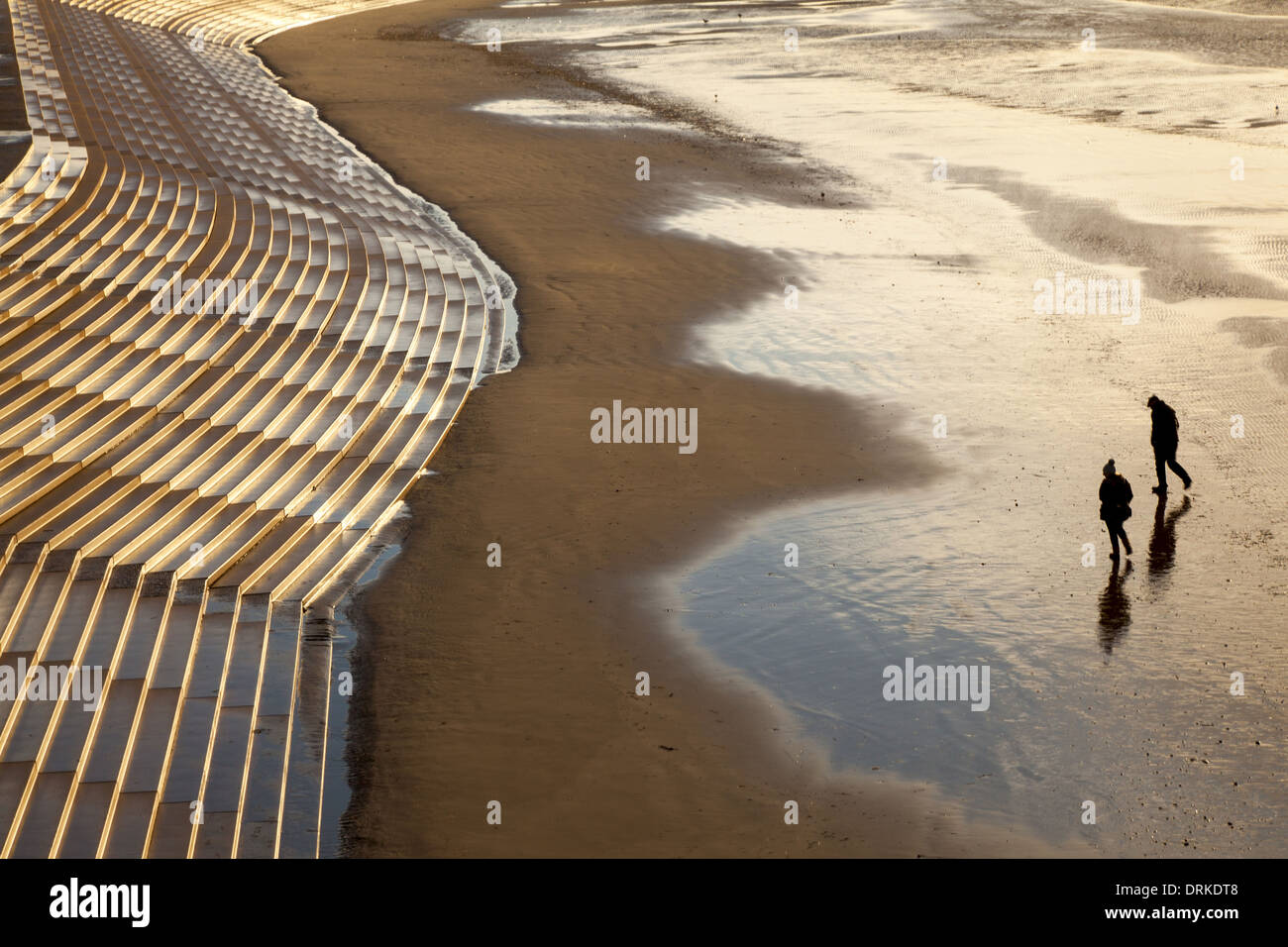 Sunny golden sandy beach reflections and Steps on the seashore on ...