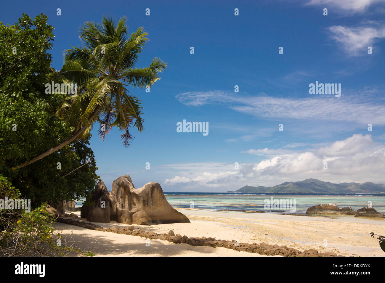 Fantastic sandy beach typical of the Seychelles rock formations behind ...