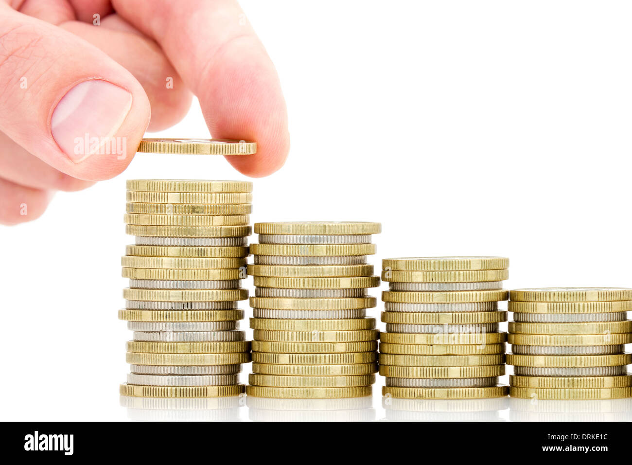 Hand put coins to stack of coins on white background. Investment or ...