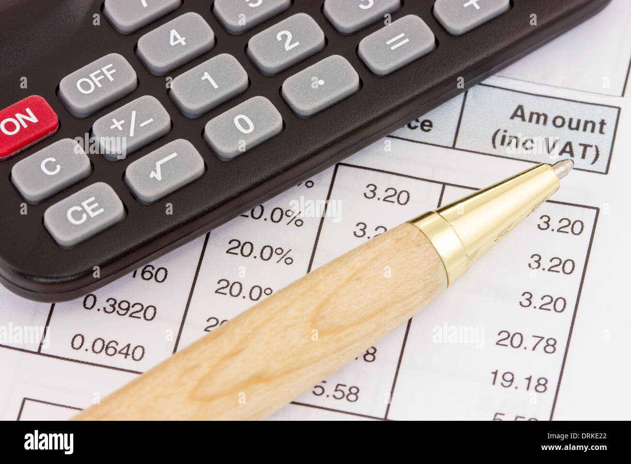 Calculator, pen and invoice with balance due Stock Photo - Alamy