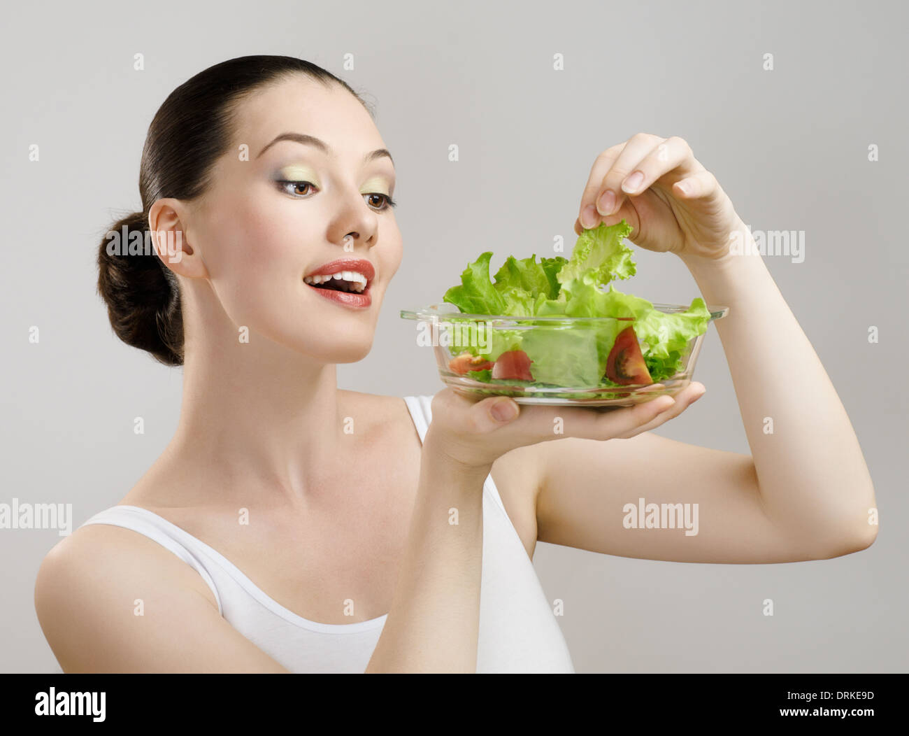 A beautiful slender girl eating healthy food Stock Photo - Alamy