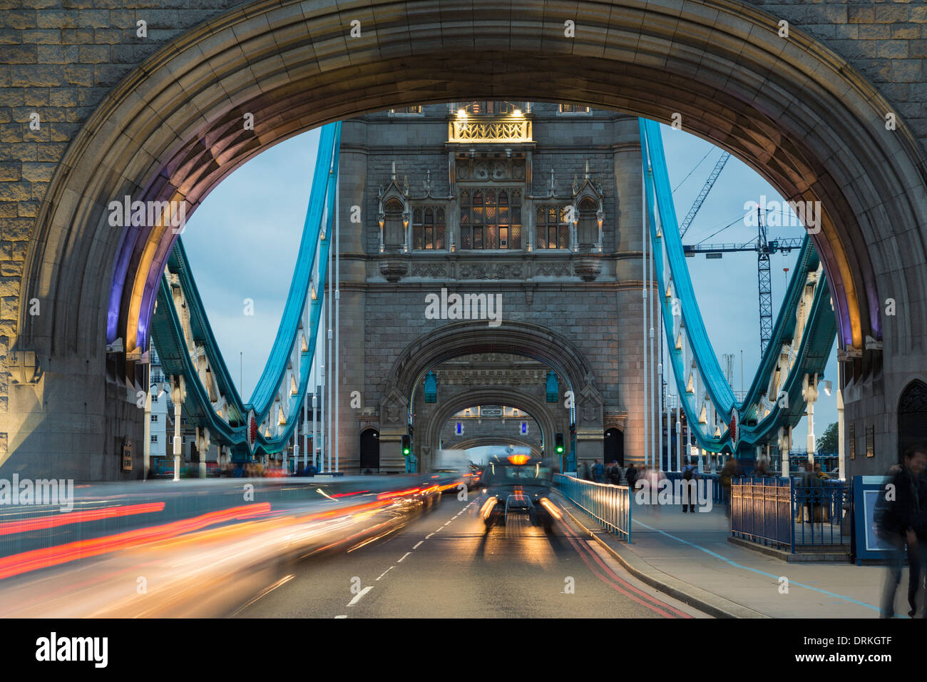 Traffic crosses Tower Bridge at twilight, London, England Stock Photo ...