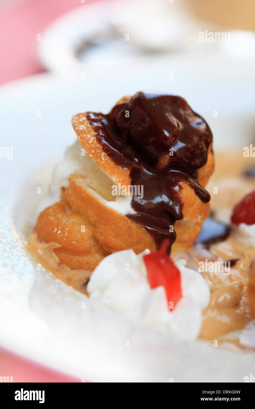 Plate chocolate profiteroles close hi-res stock photography and images ...