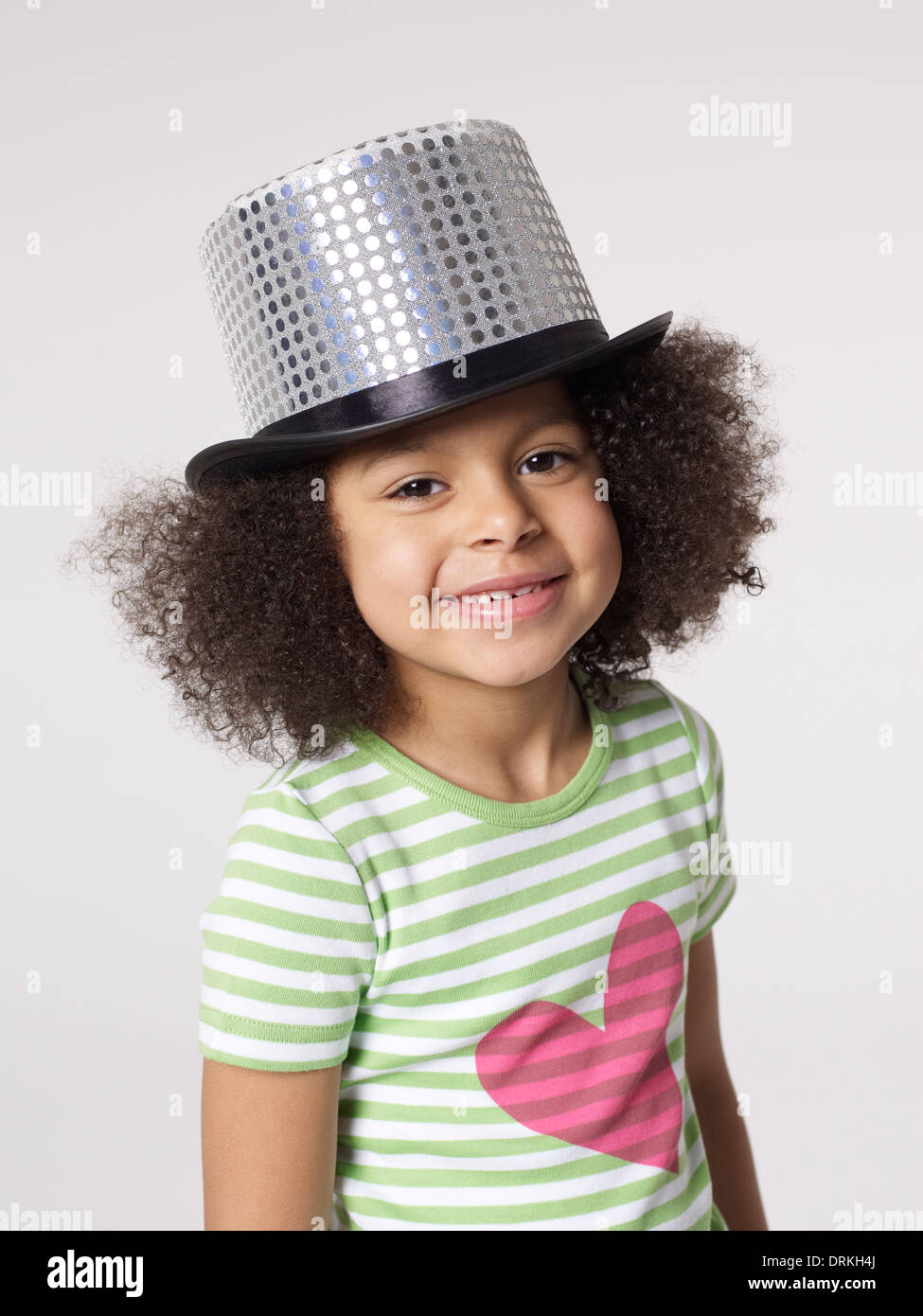 Smiling girl wearing top hat Stock Photo - Alamy