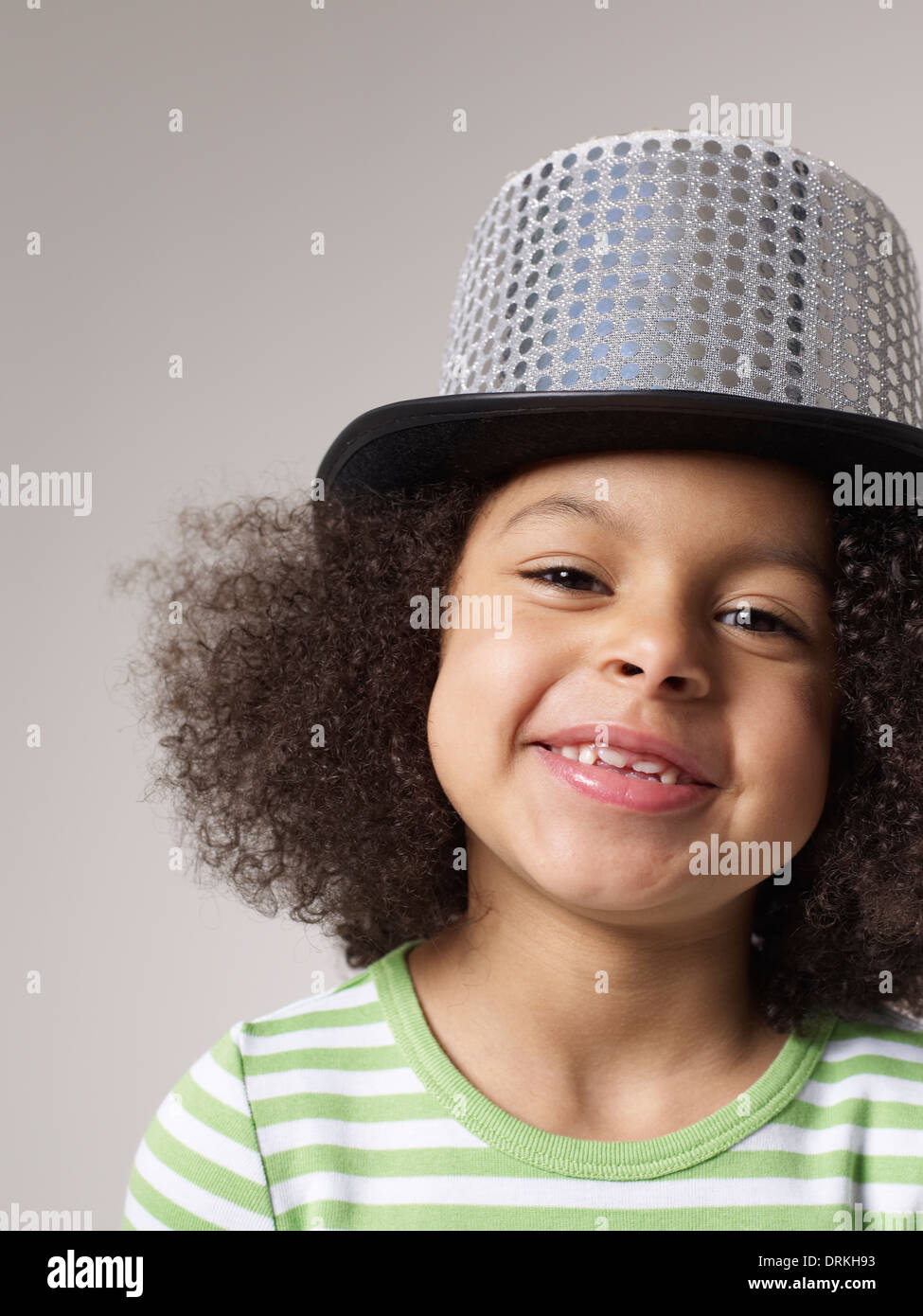 Smiling girl wearing top hat Stock Photo - Alamy