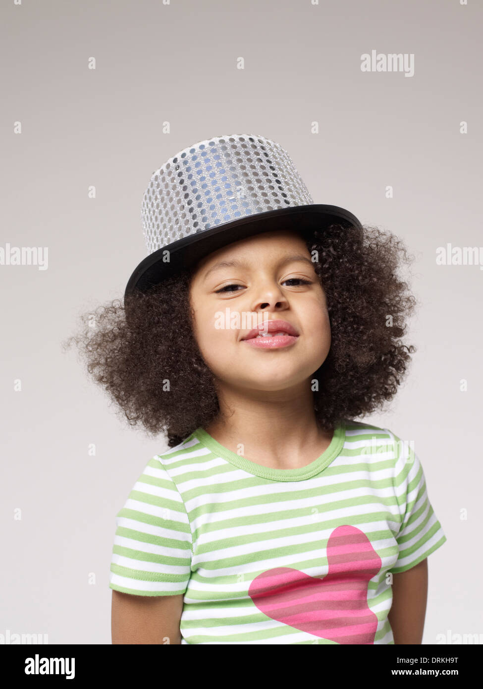 Smiling girl wearing top hat Stock Photo - Alamy