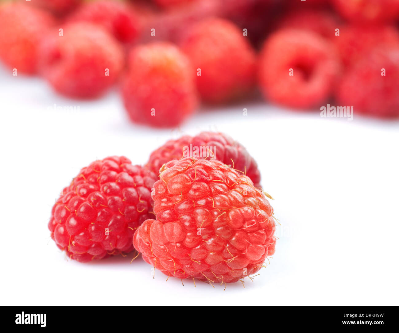 Raspberries isolated on white with fruit background Stock Photo - Alamy