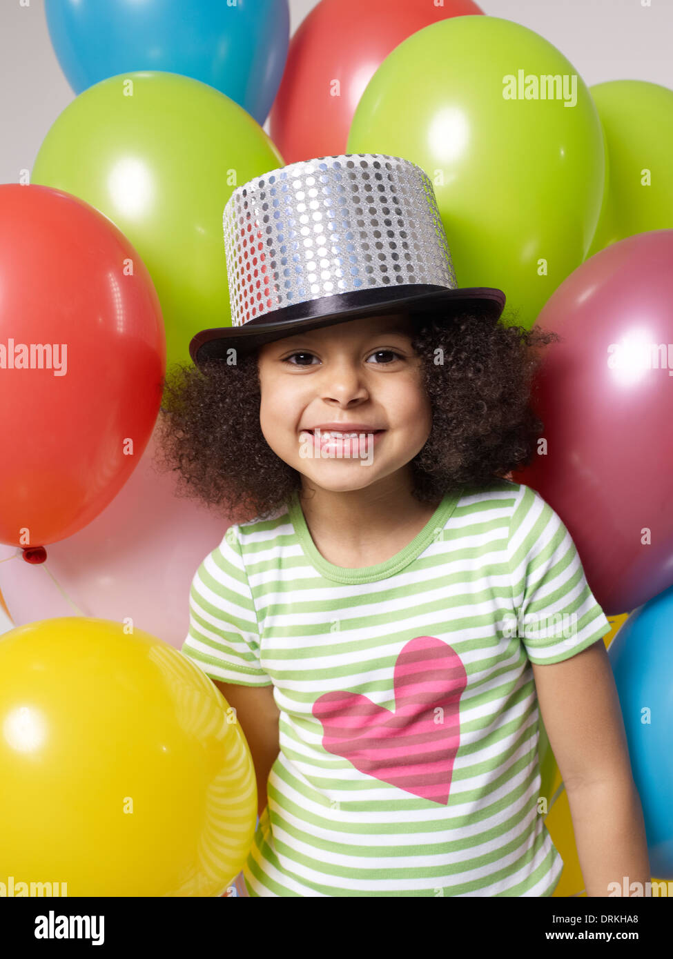 Smiling girl wearing top hat Stock Photo - Alamy