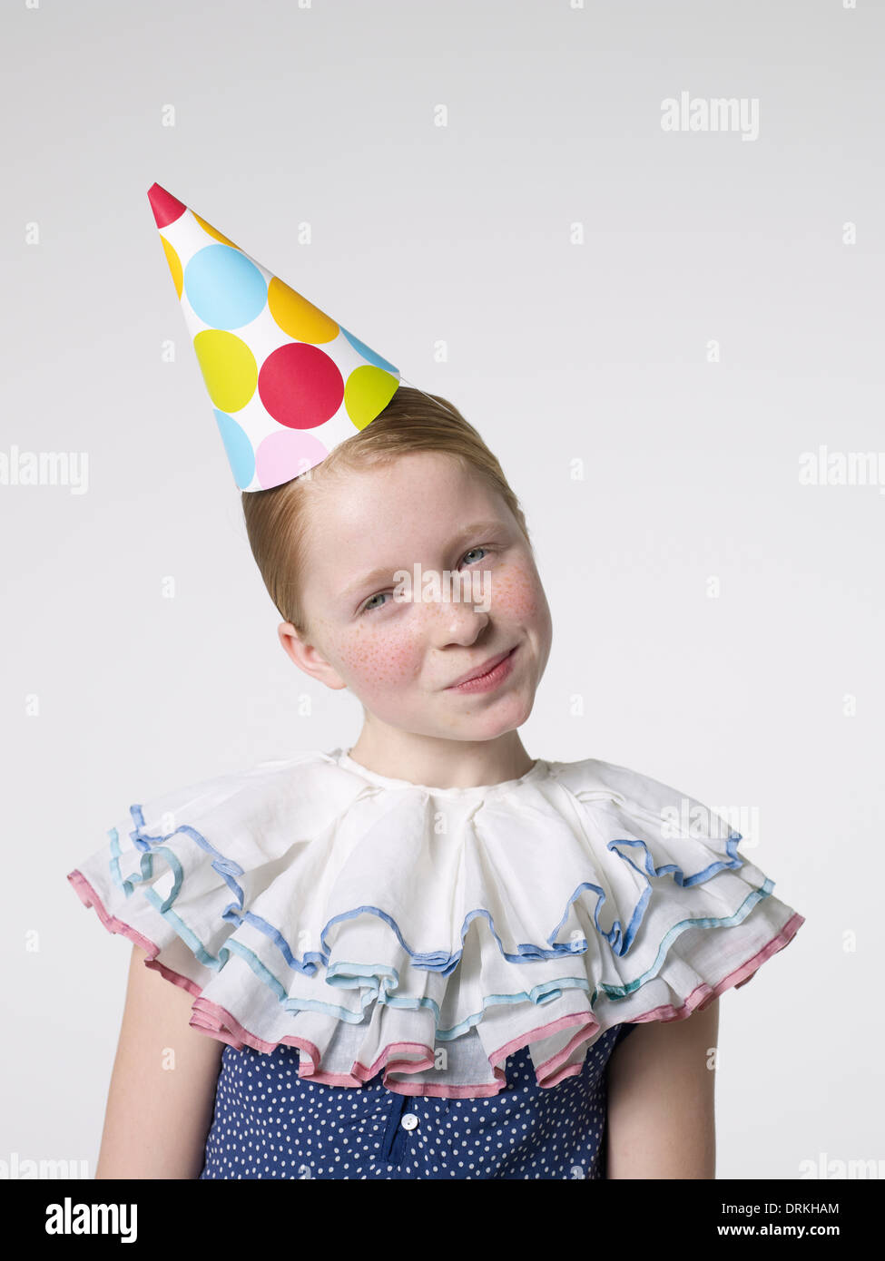 Girl wearing party hat Stock Photo - Alamy