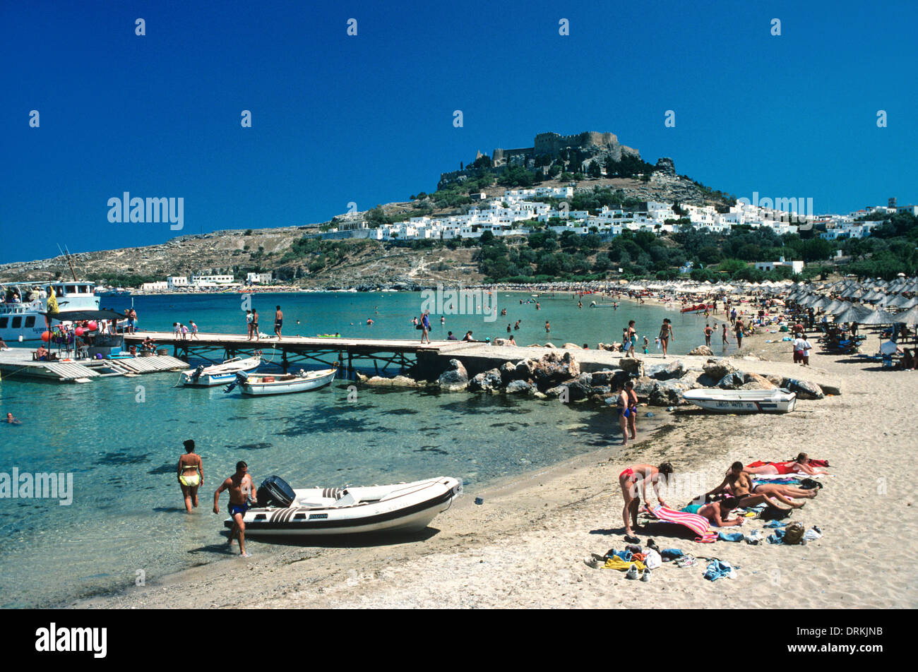 Beach & Jetty at Lindos Beach Bay and Peninsula Rhodes Greece Stock ...
