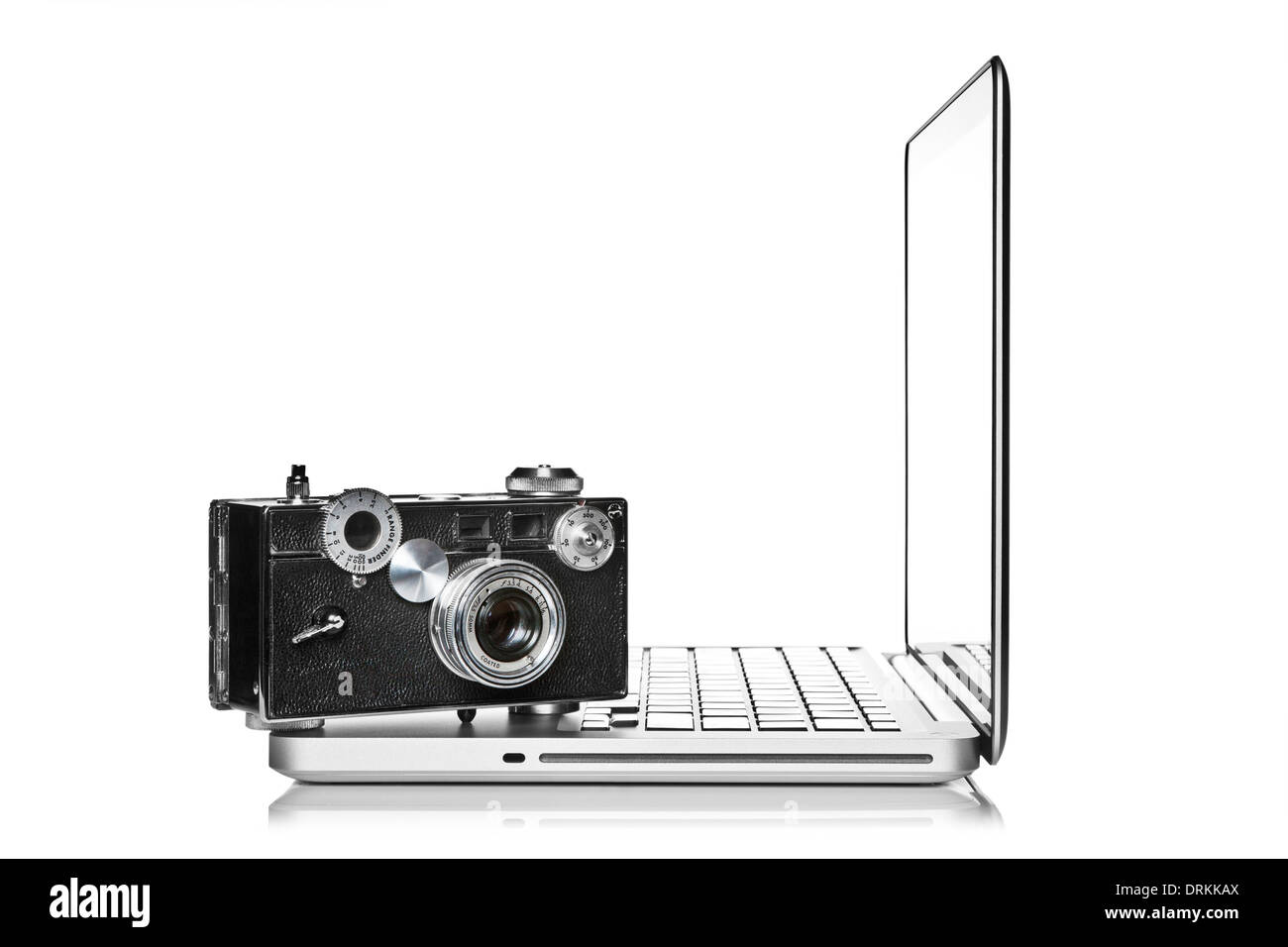 Antique camera placed on a laptop computer Stock Photo - Alamy