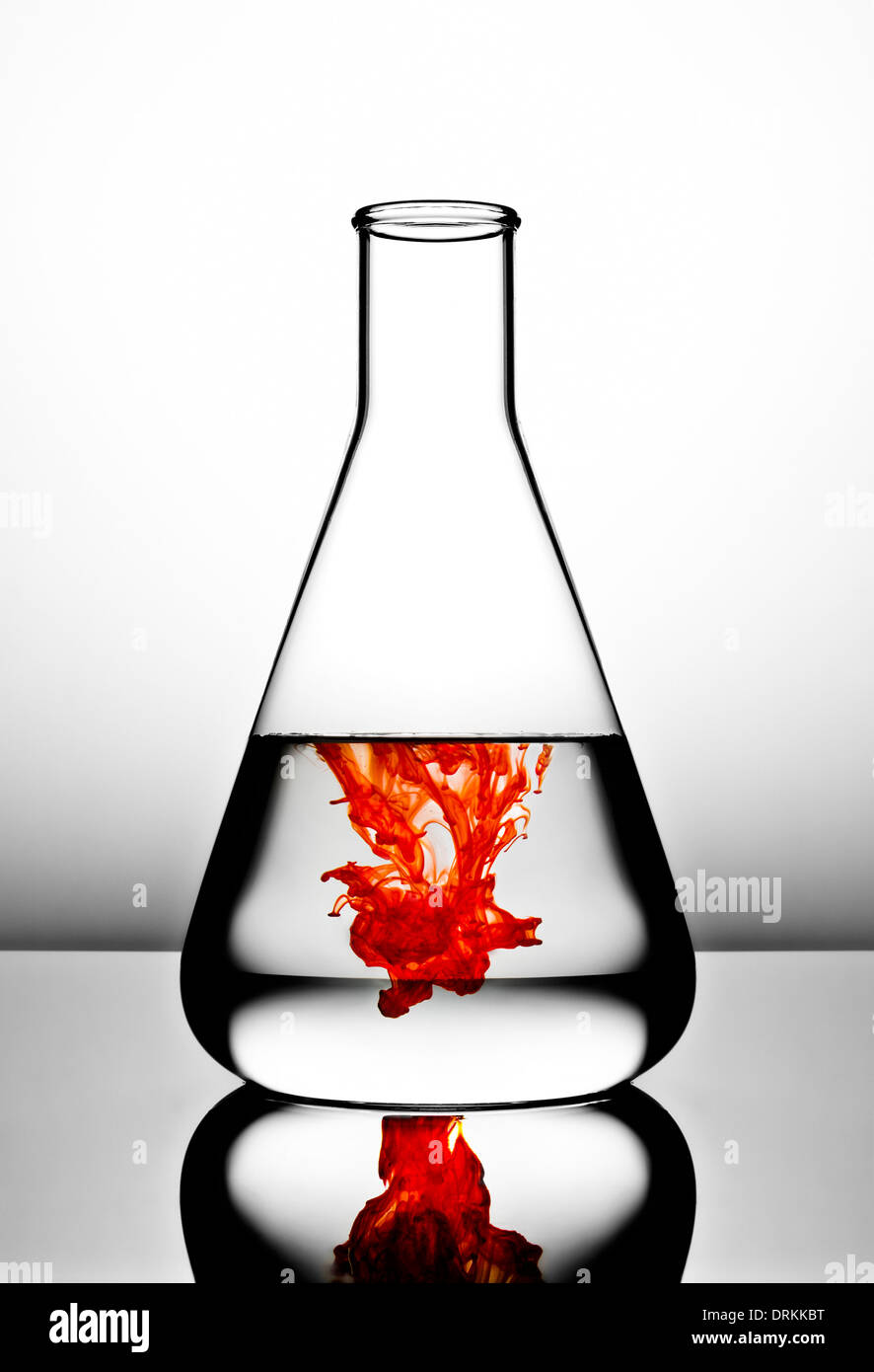 Beaker with red dye Stock Photo - Alamy