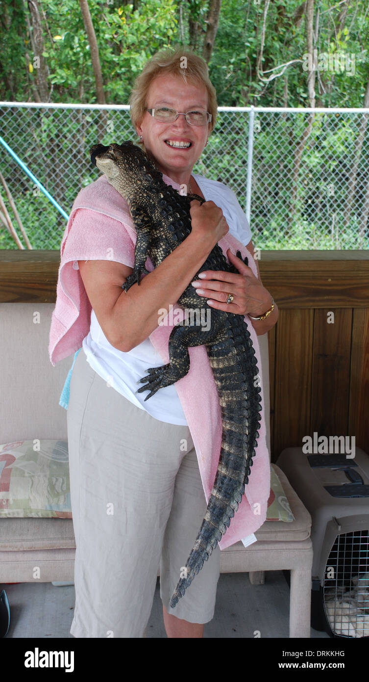 Holding alligators hi-res stock photography and images - Alamy