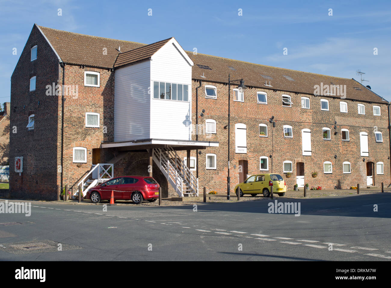 Old river side mill building restored for domestic living Stock Photo ...