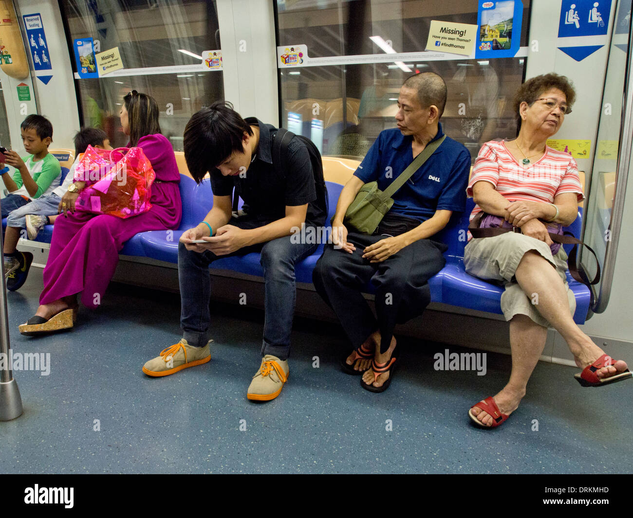 Passengers in MRT train in Singapore Stock Photo - Alamy