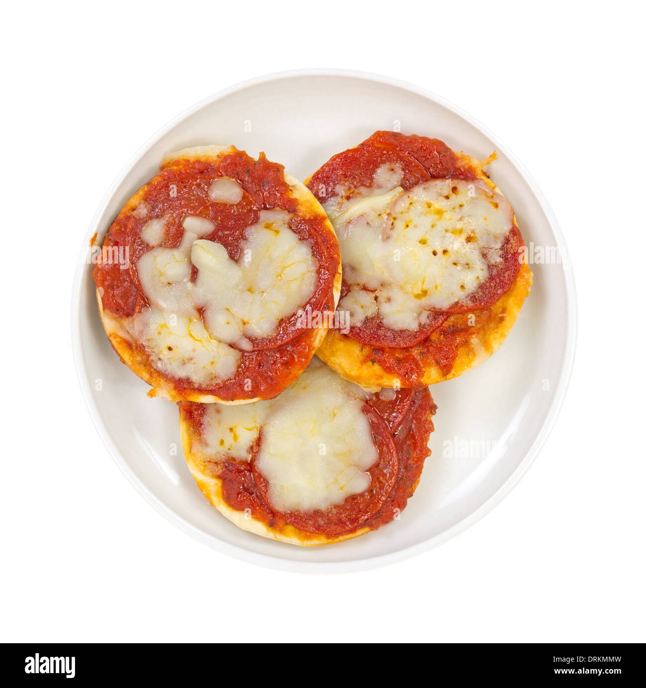 Top view of three cooked pepperoni pizzas in a very small dish on a ...