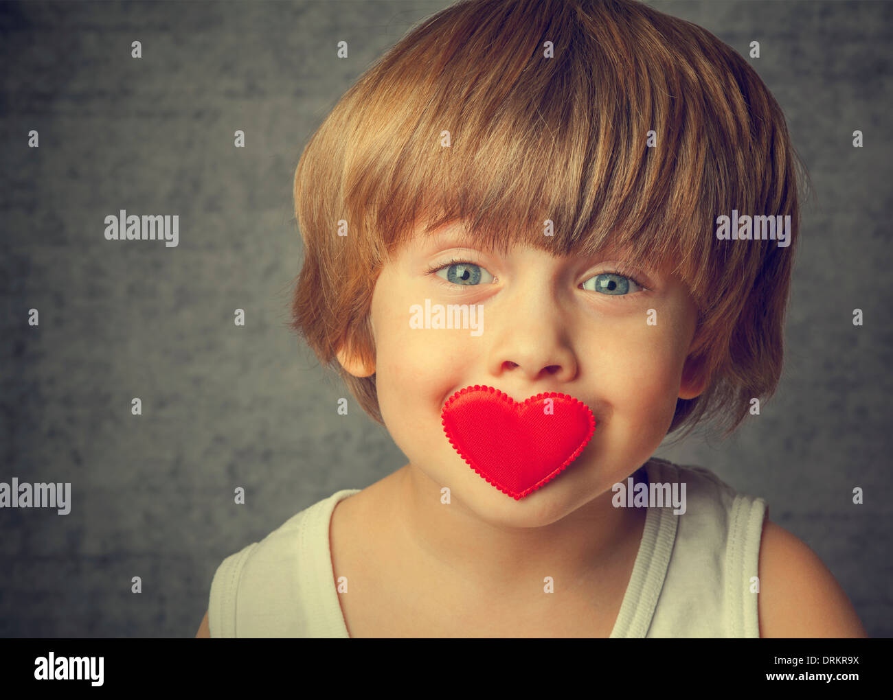 Smiling boy kid child heart love hi-res stock photography and images ...