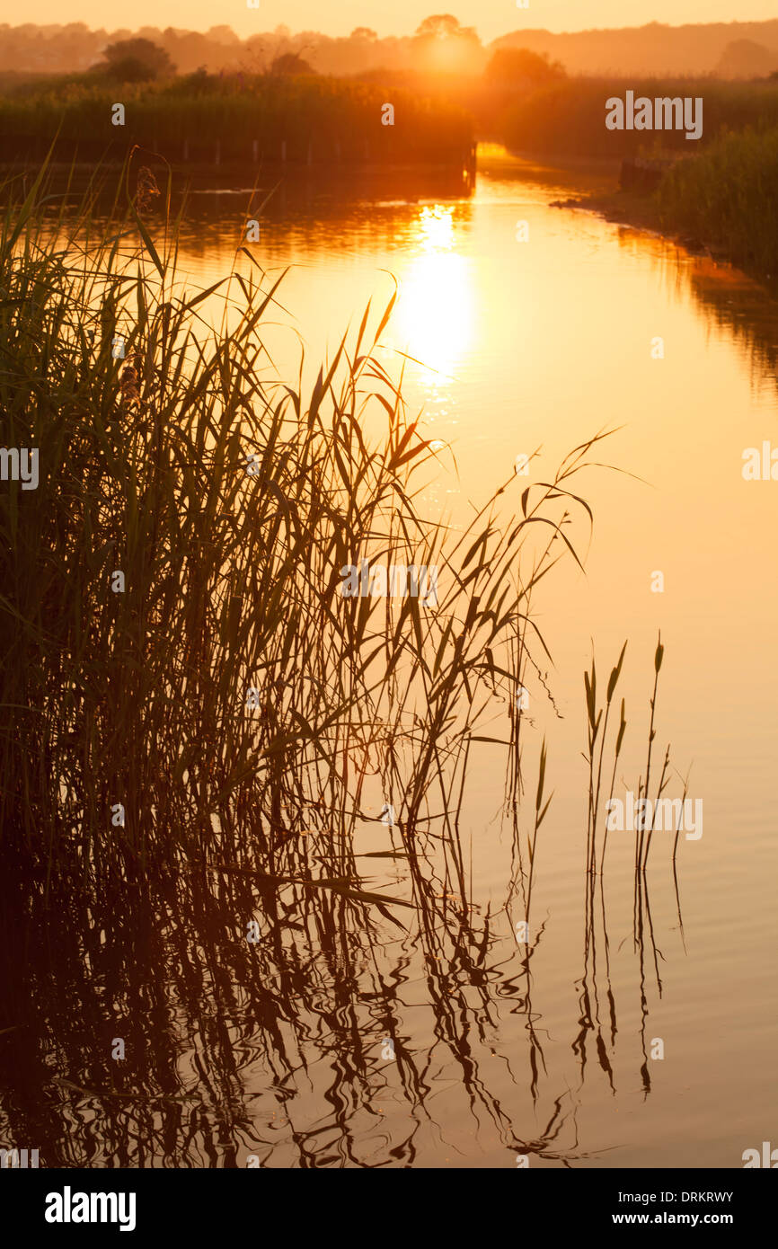 Sunset over a lake at Southwold, Suffolk, UK Stock Photo - Alamy