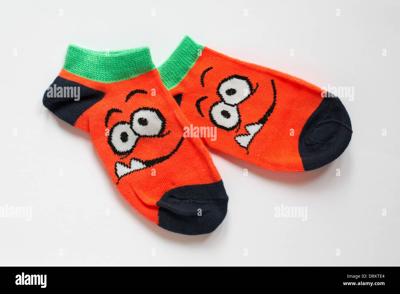 Pair of children's colourful scary face socks isolated on white ...