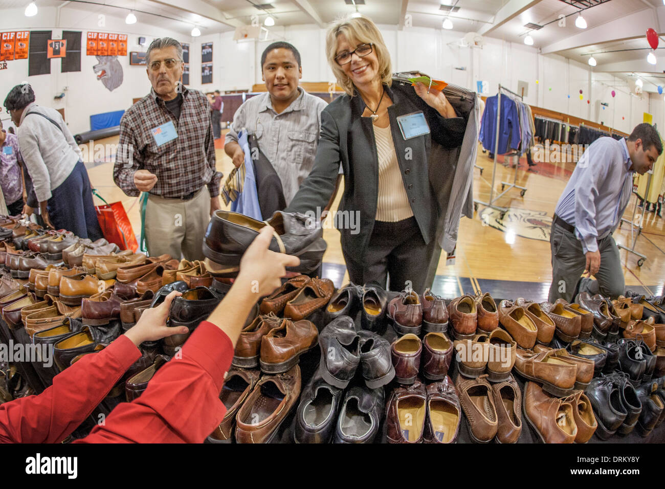 Men get new business clothing and shoes from Working Wardrobes, a organization helping the ...