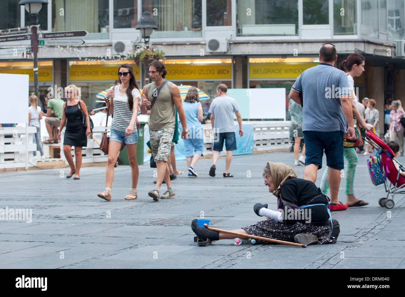 Woman begging in the street hi-res stock photography and images - Alamy
