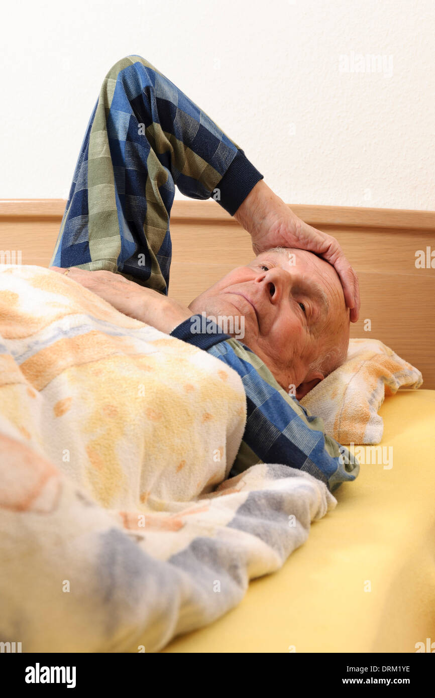 Old man awakening Stock Photo - Alamy