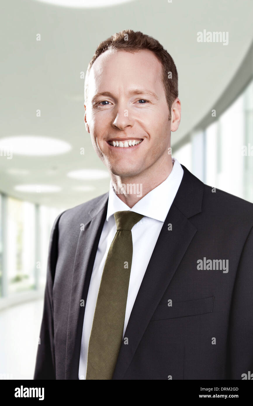 Portrait of smiling businessman Stock Photo - Alamy