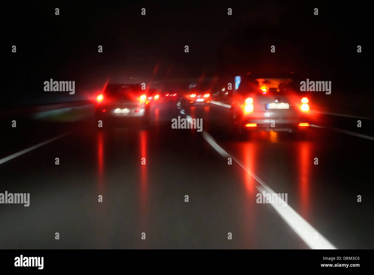 Driving by night at wintertime on motorway Stock Photo - Alamy