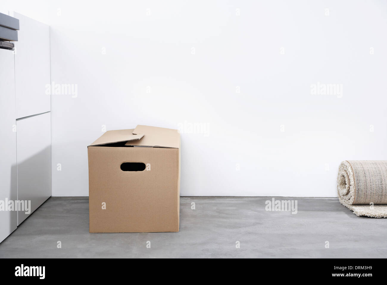 Cardboard box at living room Stock Photo - Alamy