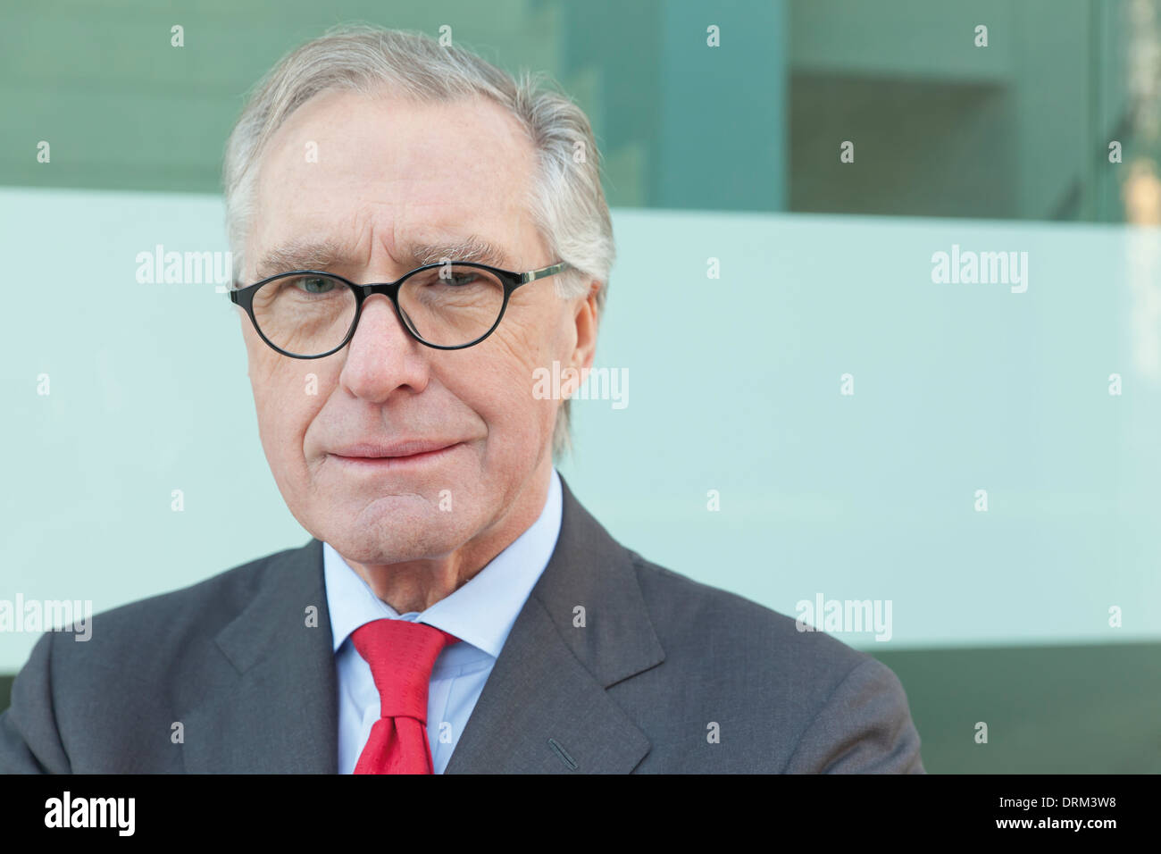 Portrait of serious looking senior business man Stock Photo - Alamy