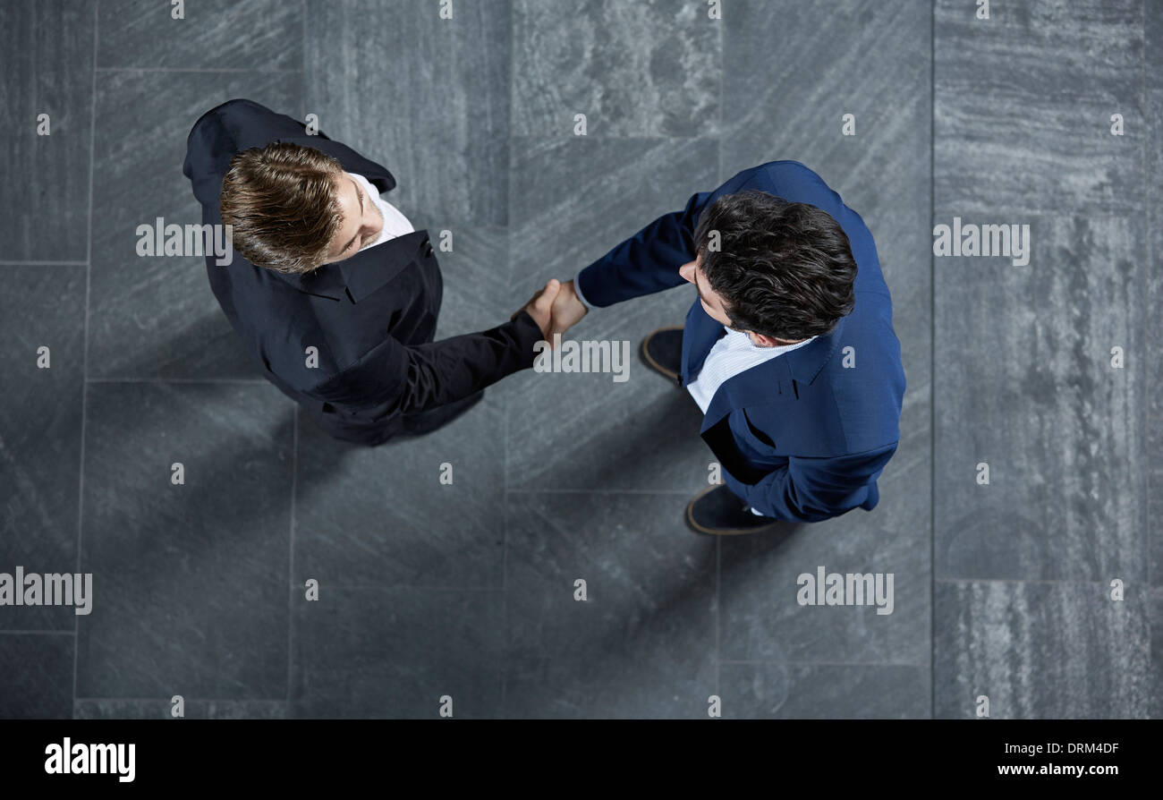 Germany, Neuss, Business men shaking hands Stock Photo - Alamy