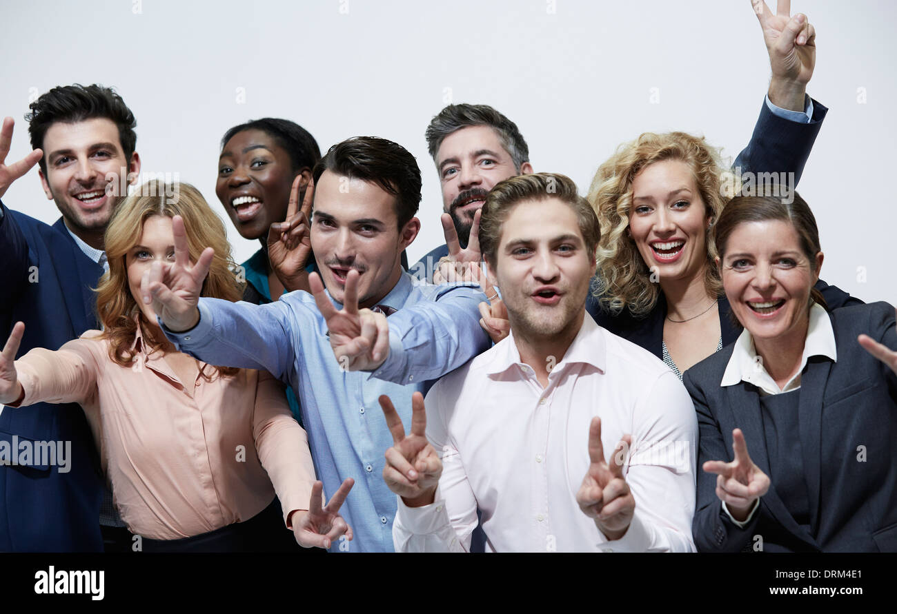 Germany, Neuss, Group of business people, giving victory sign Stock ...