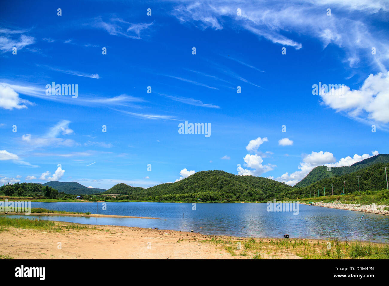 Blue sky, white clouds and reservoir Stock Photo - Alamy
