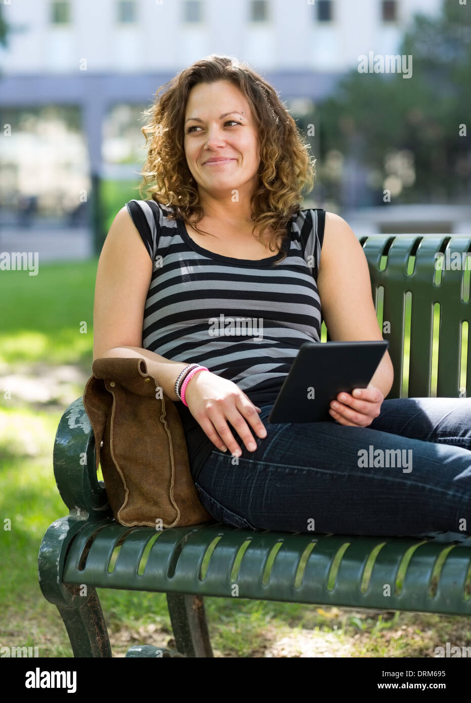 Thoughtful University Student Relaxing On Bench Stock Photo - Alamy