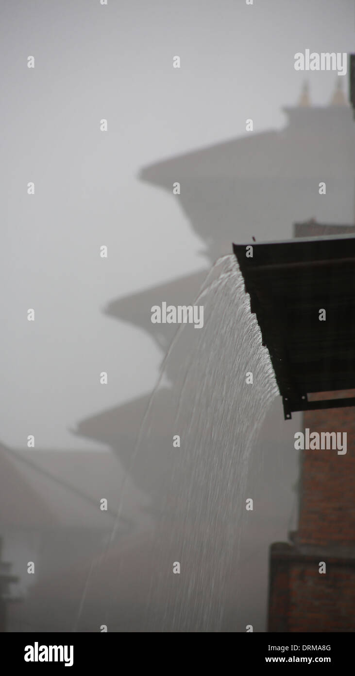 Rain water falling of roof Stock Photo - Alamy