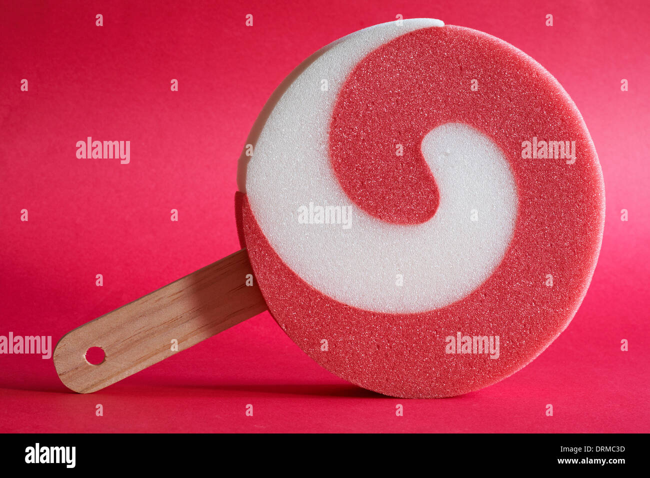 sponge lolly isolated on red background Stock Photo - Alamy