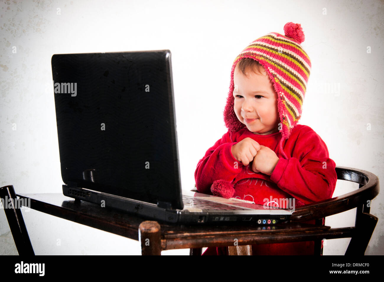 Scared kid watching scary movies on laptop computer.Selective focus on ...