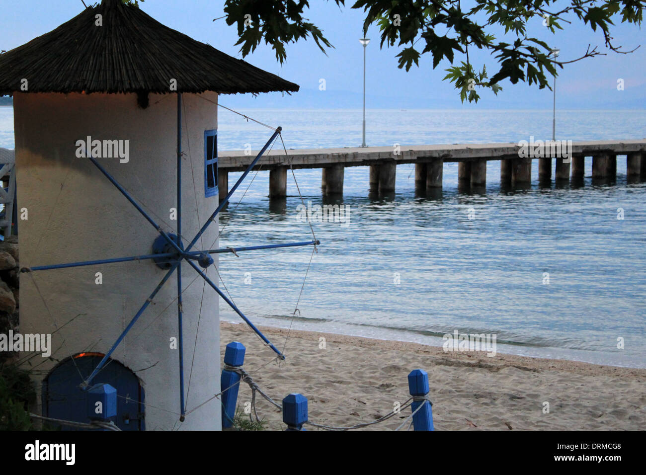 Small windmill on the beach Stock Photo - Alamy