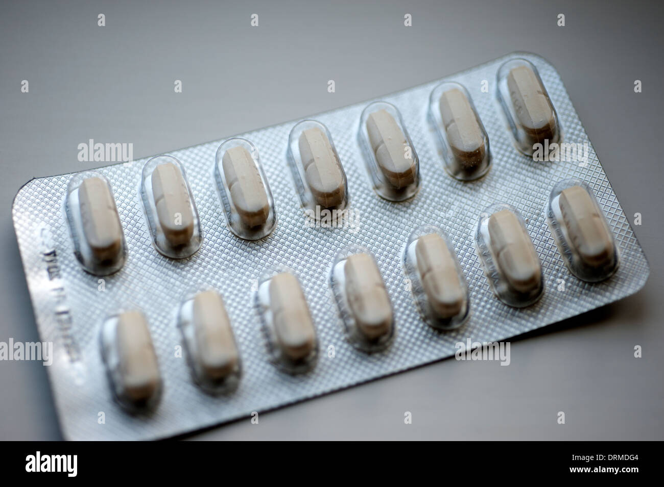 Strip of tablets foil bubble packed Medicine Stock Photo - Alamy