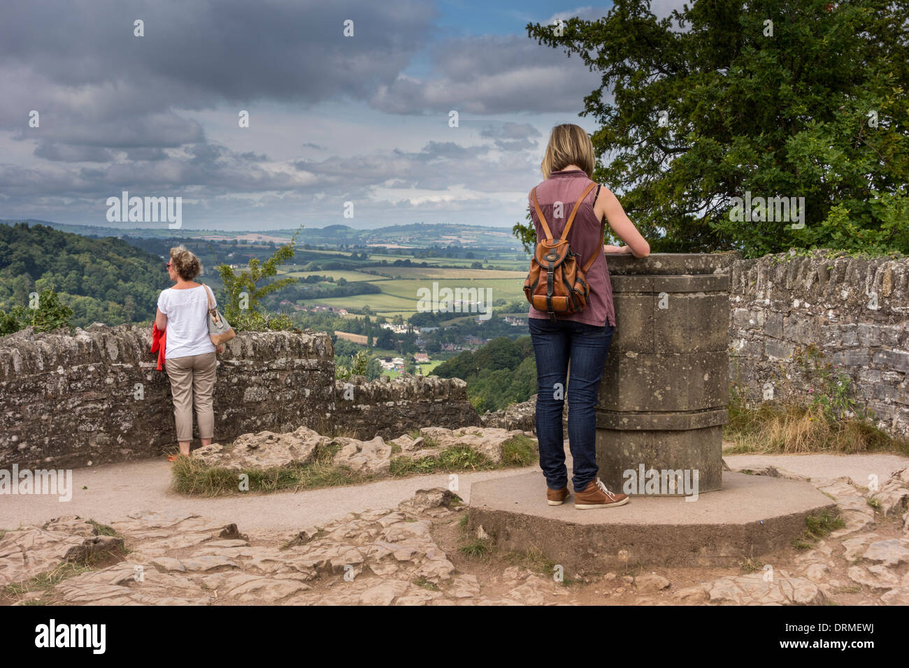 Symonds Yat Rock viewpoint, Gloucestershire, UK. One woman surveying ...