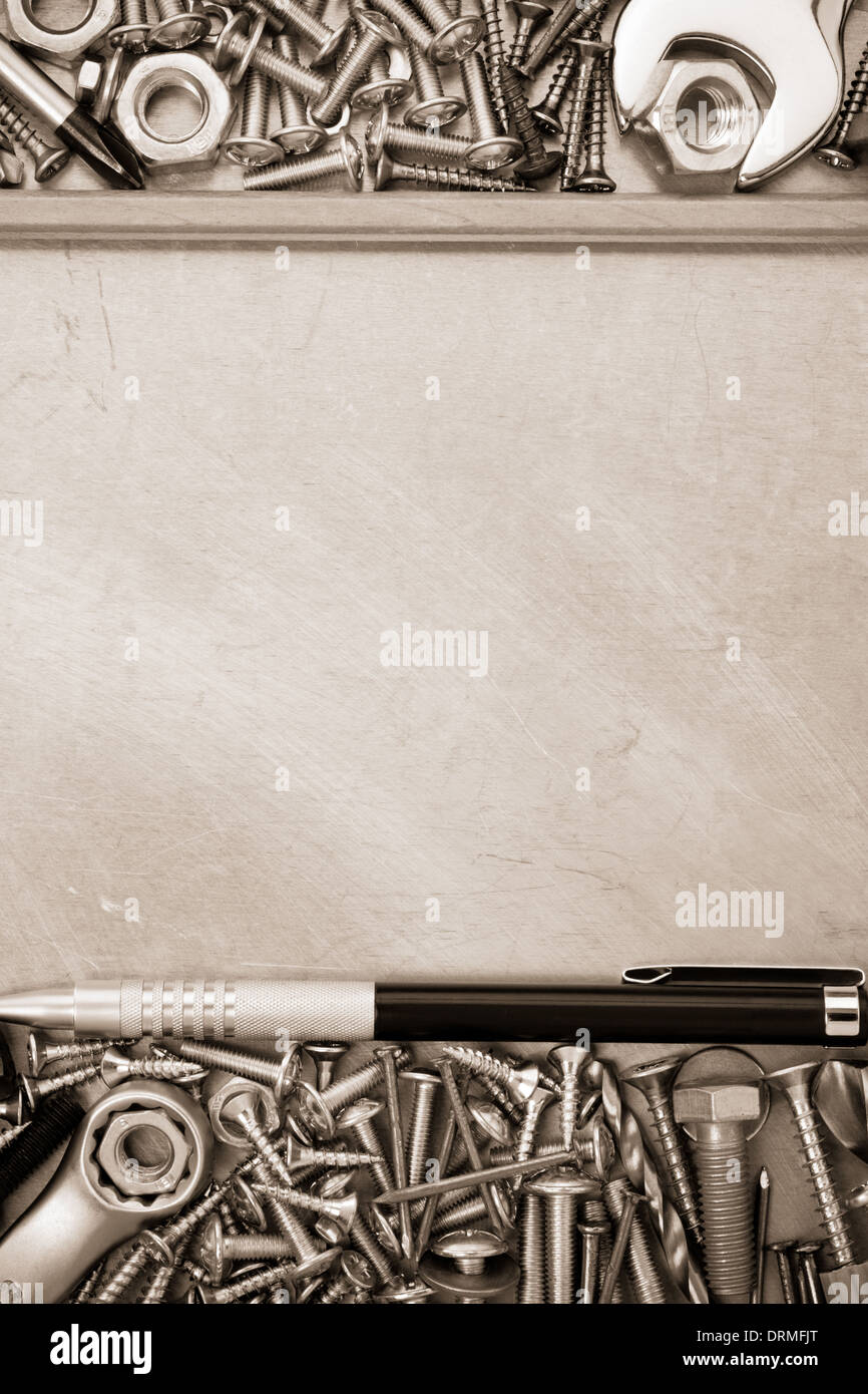 metal construction hardware tool on metal texture Stock Photo - Alamy