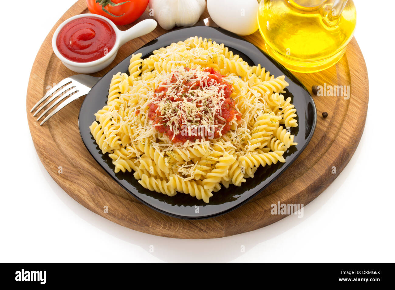 pasta fusilli in plate isolated on white background Stock Photo - Alamy