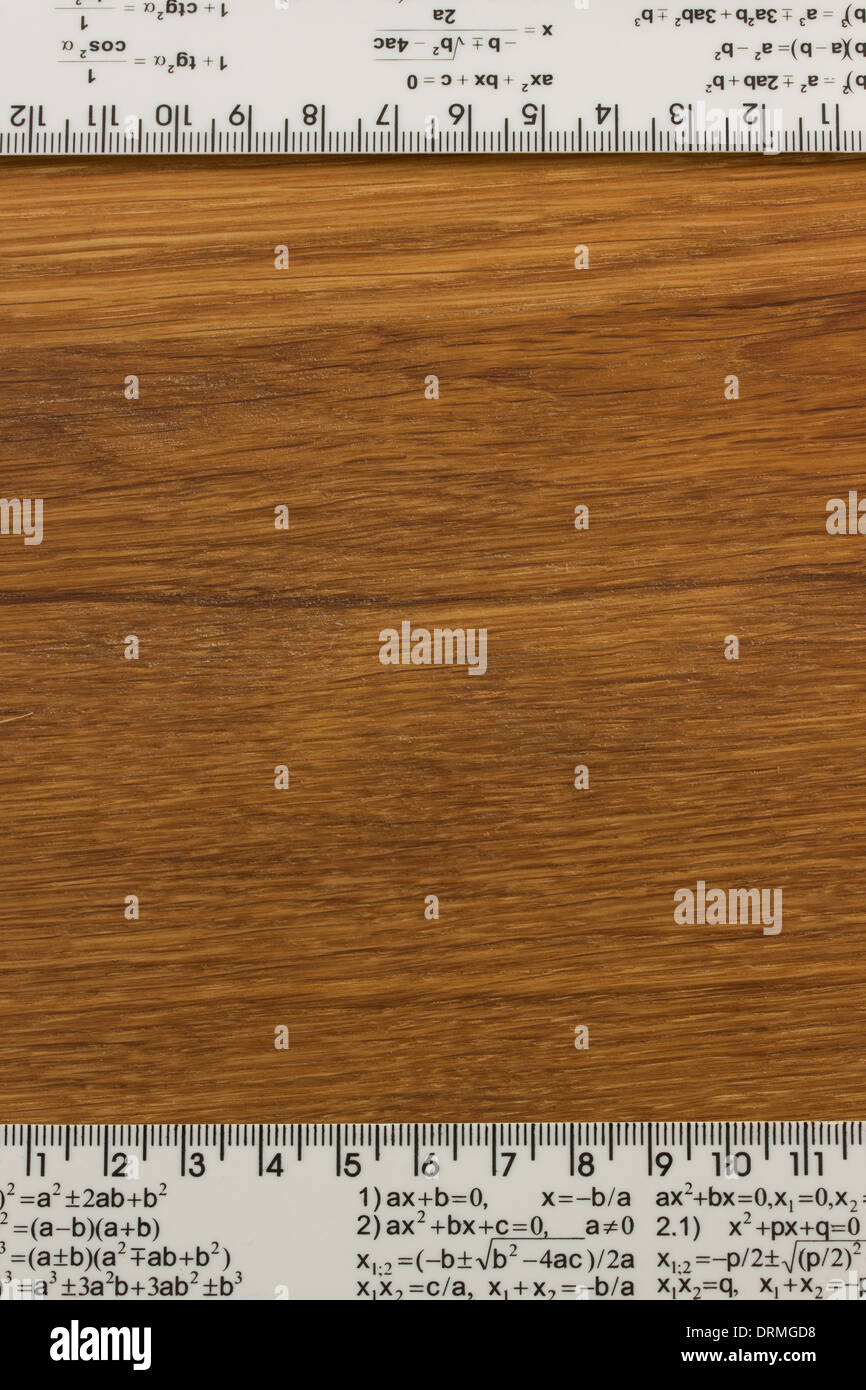 plastic rulers at wood background Stock Photo - Alamy
