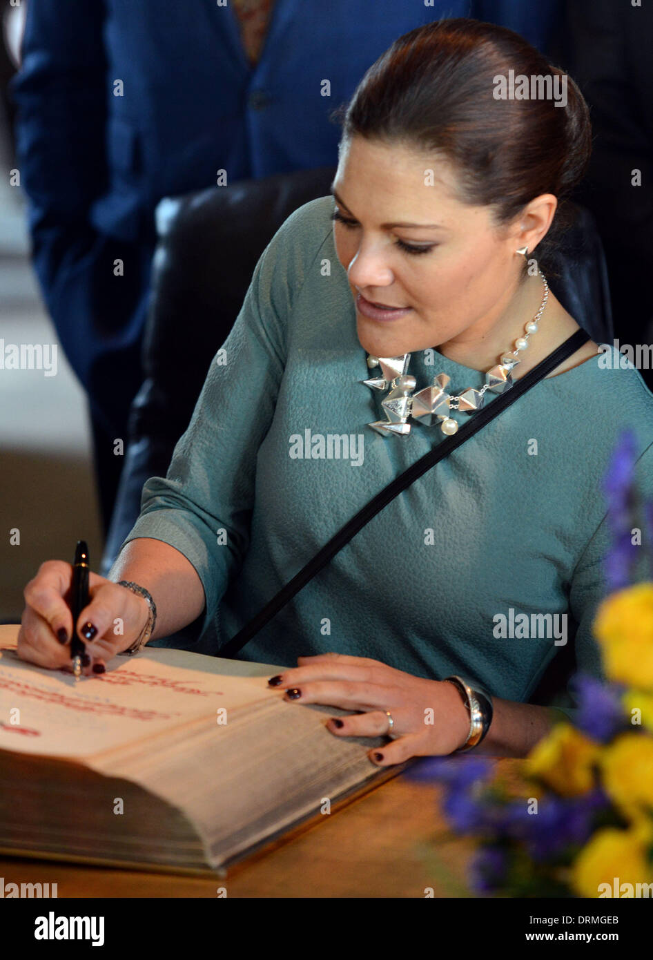 Essen, Germany. 29th Jan, 2014. Sweden's Crown Princess Victoria signs ...