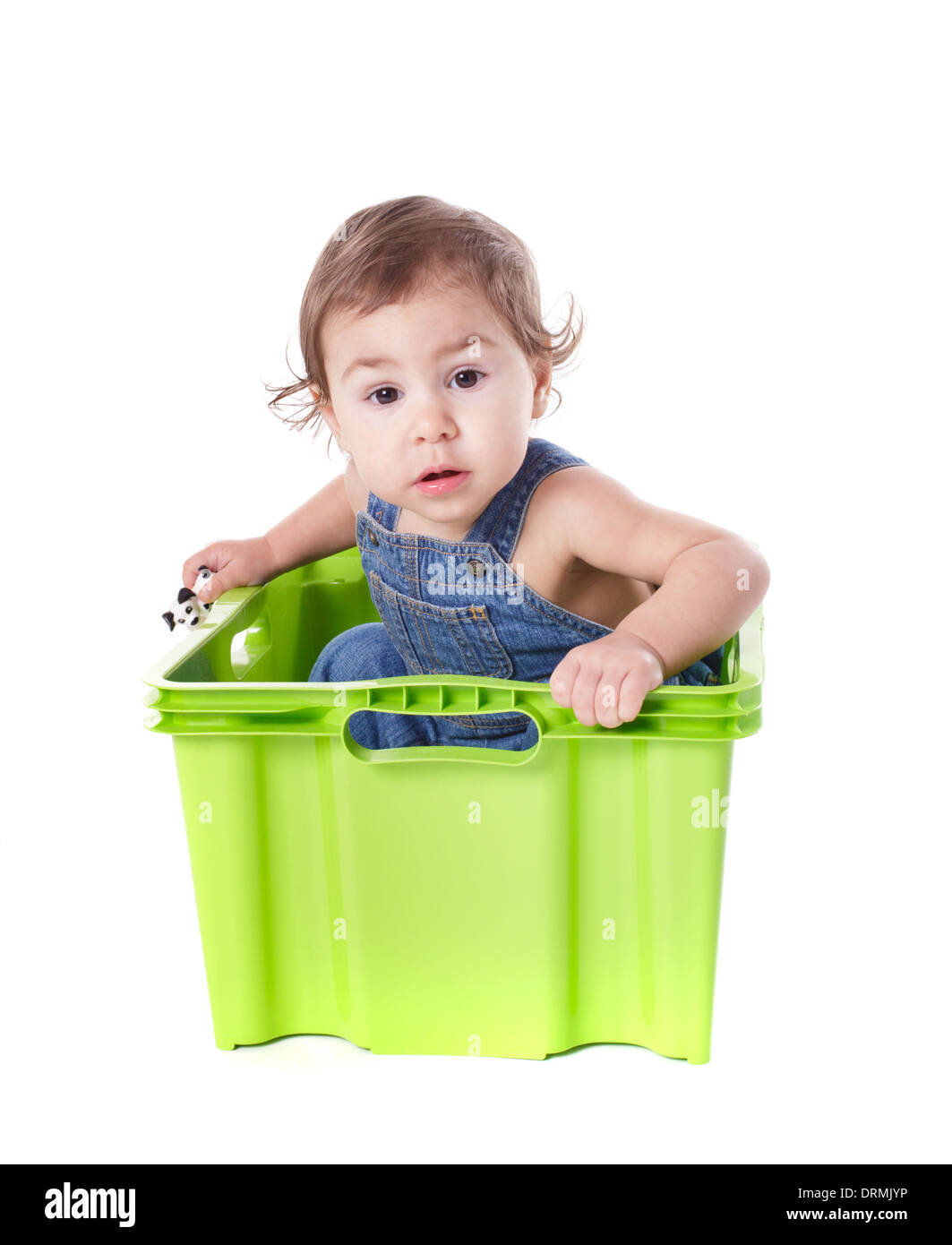 Kid plays with container Stock Photo - Alamy