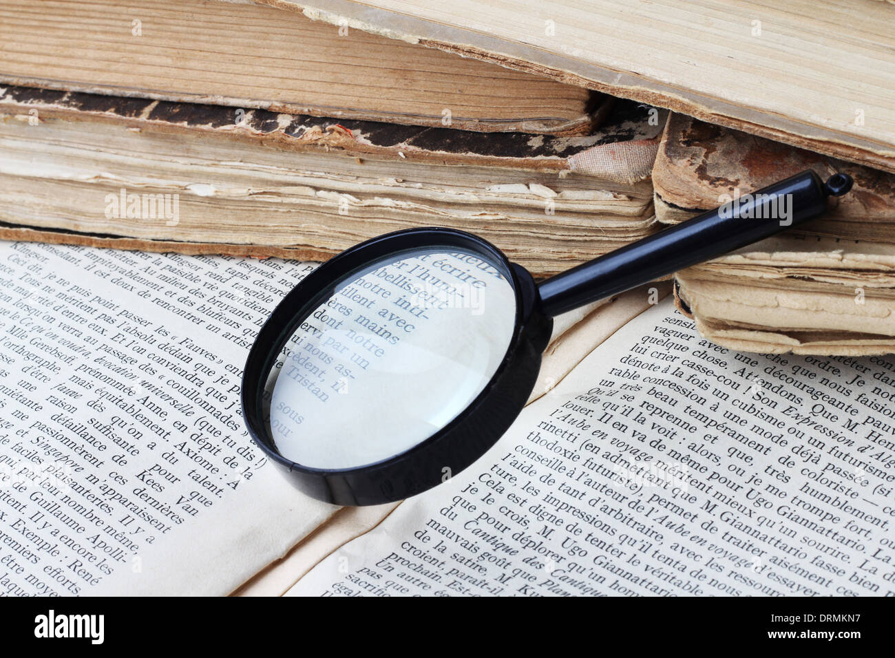 An open book with magnifying lens hi-res stock photography and images ...