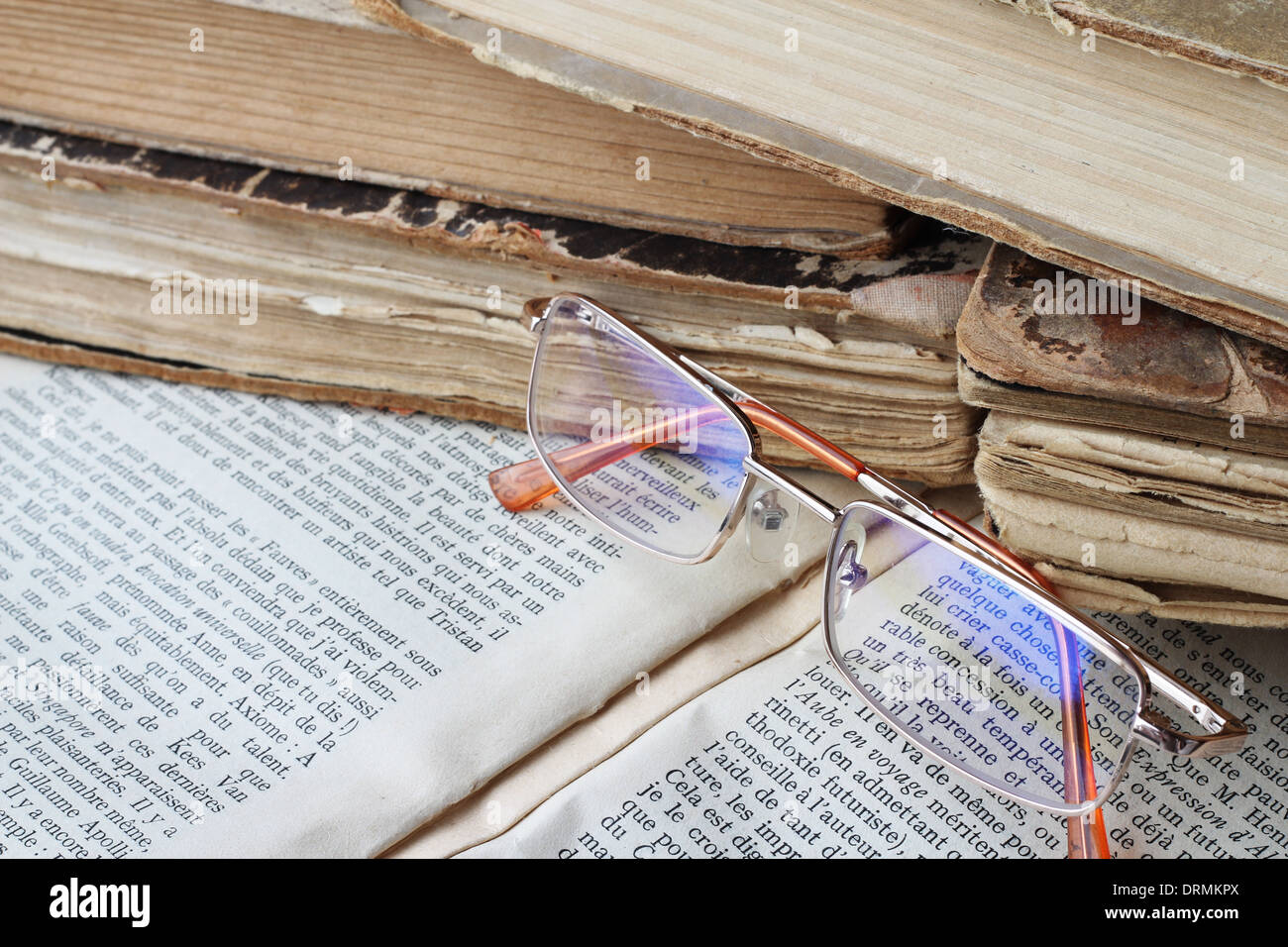 Glasses on book Stock Photo - Alamy