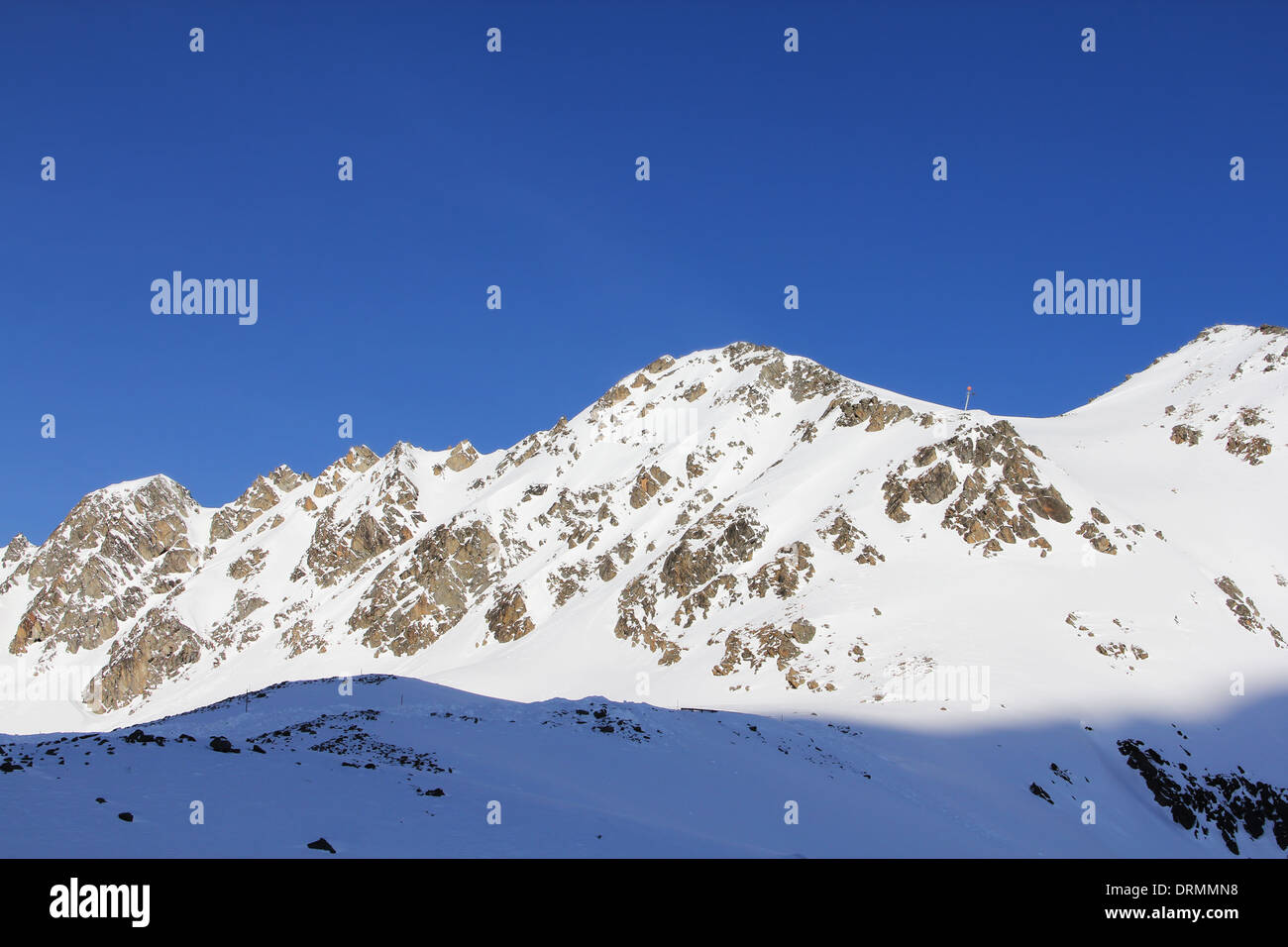 Winter alpine mountains covered with snow Stock Photo - Alamy