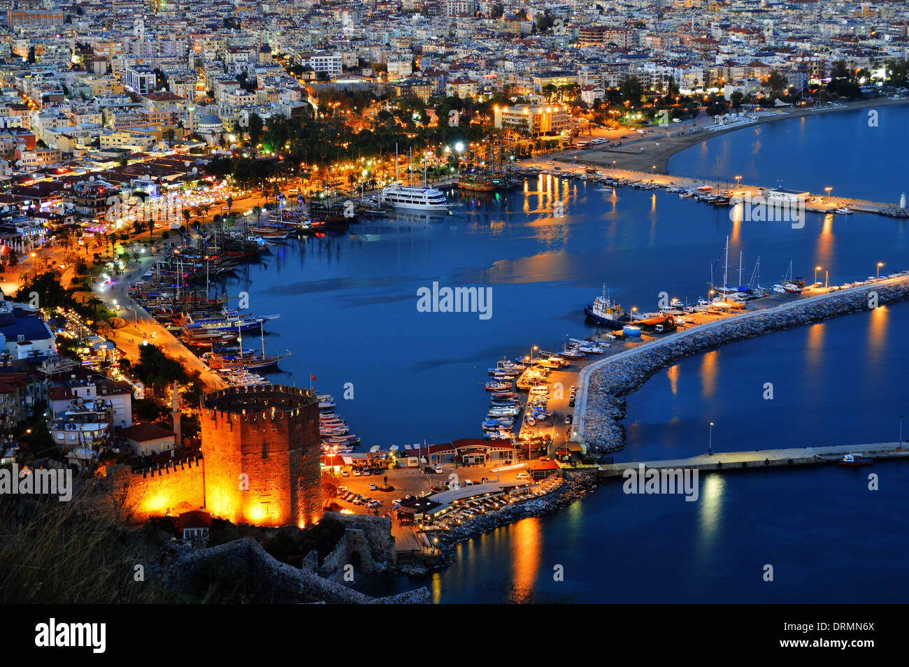 View of Alanya harbor from Alanya peninsula. Turkish Riviera by night ...