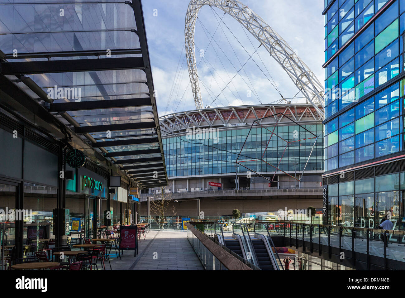 Wembley stadium arch viewed through the London Designer outlet building ...